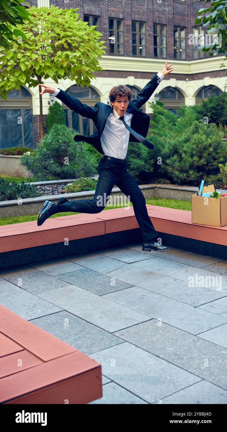 Dance of freedom. Happy young man in formal wear cheerfully and ...
