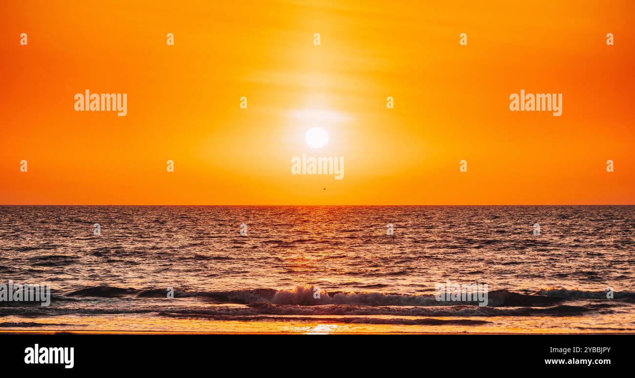 Natural Color Sunset Sunrise Sky Over Sea. Seascape With Shining ...