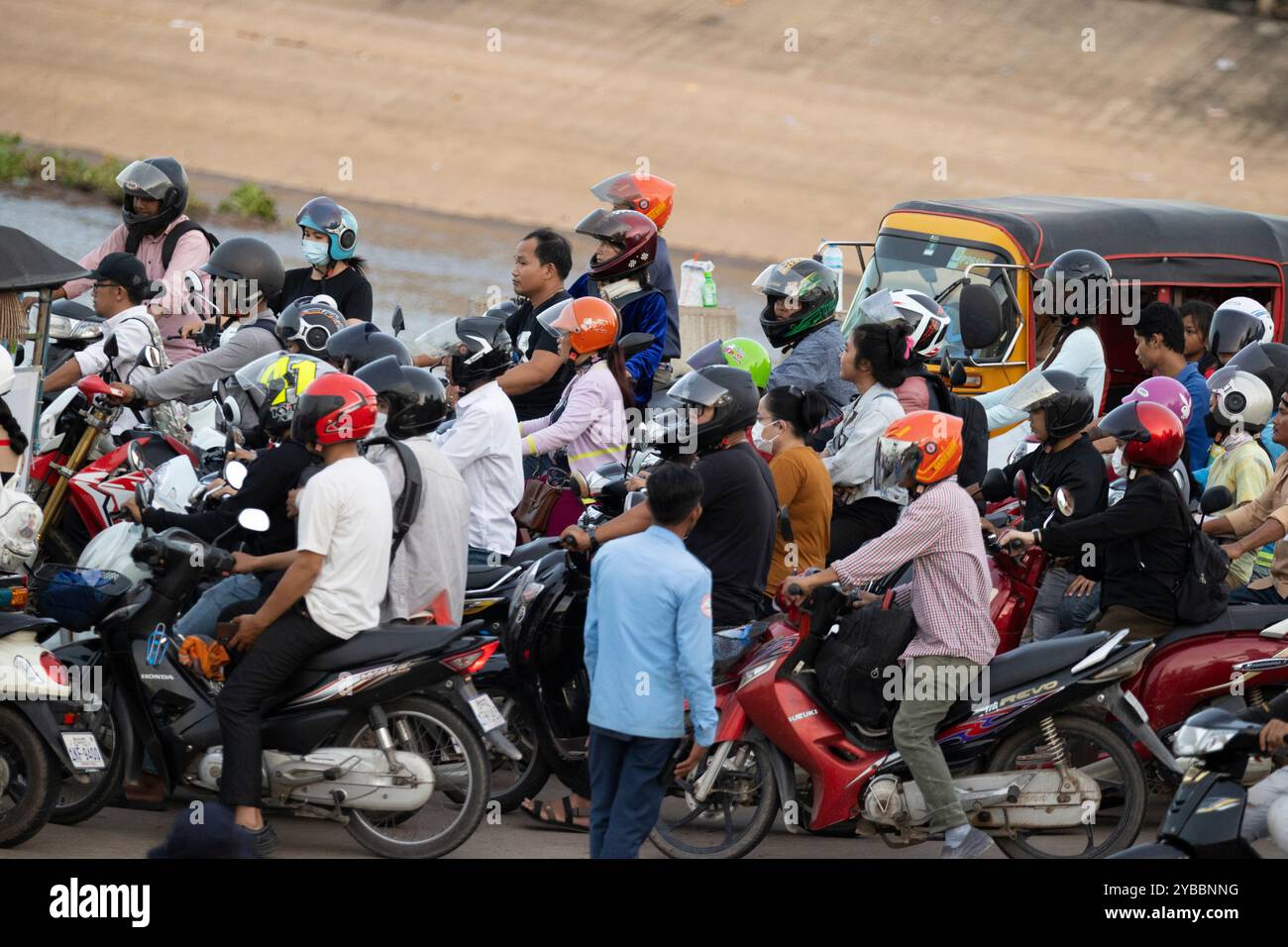 People crossing Tonle Sap river on a ferry at Kampong Chamlong Phnom ...