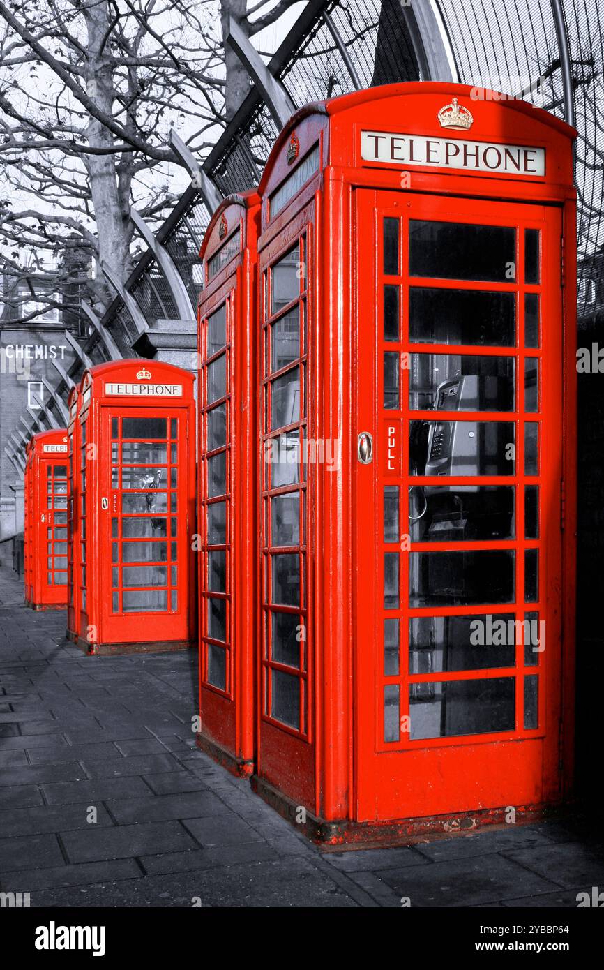Row of traditional red phone booths in central London, UK Stock Photo ...