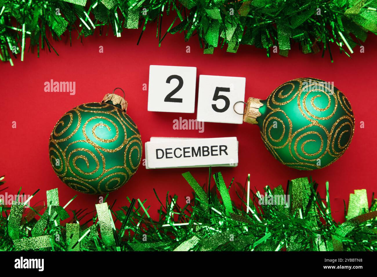 Wooden calendar with date of 25 december on red background with green ...