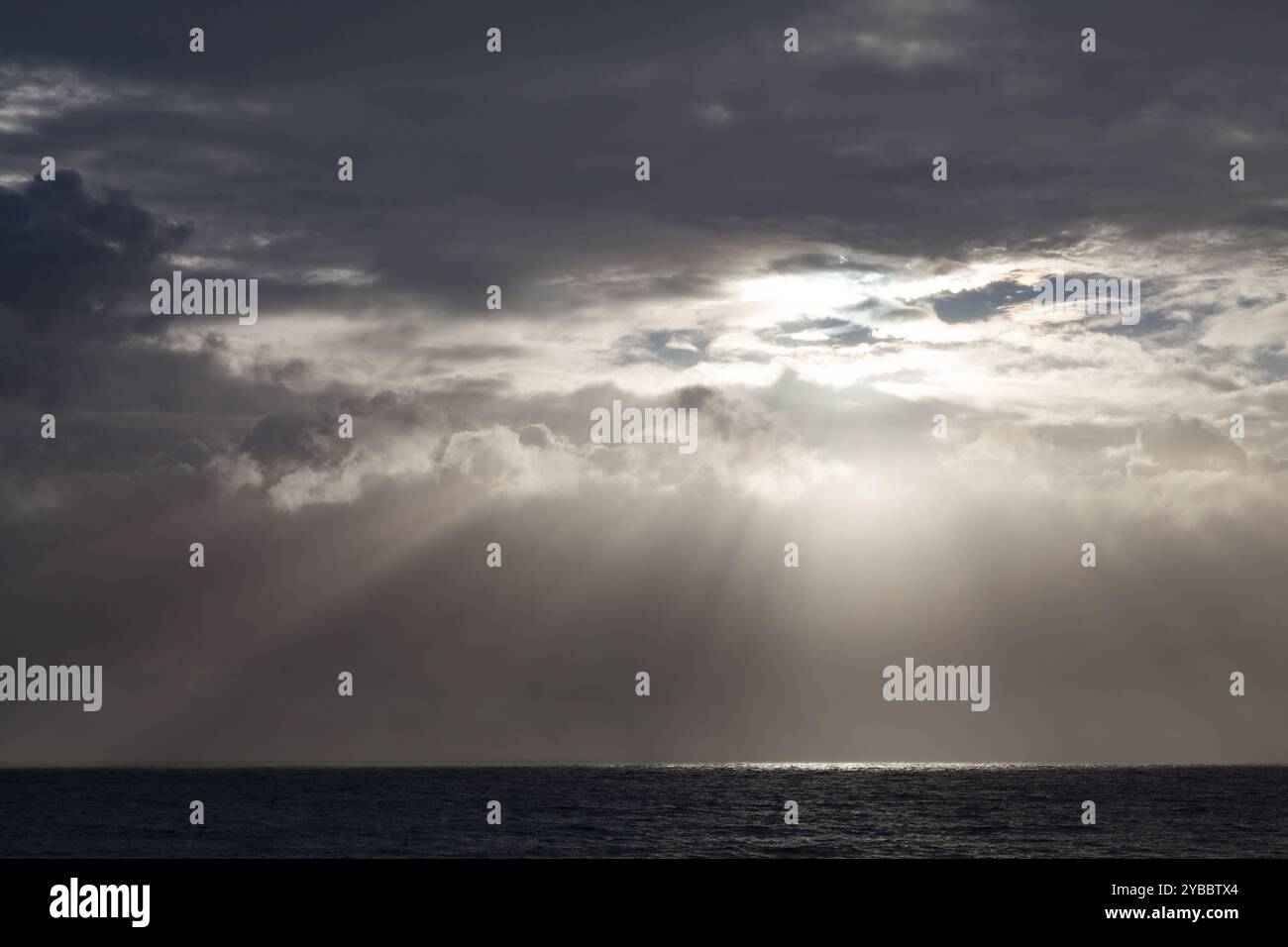 Sunlight shining through clouds, giving rise to crepuscular rays ...