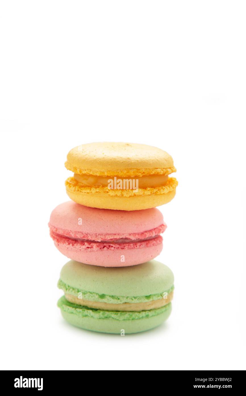 A vertical stack of three macarons isolated on white background. Sweet ...