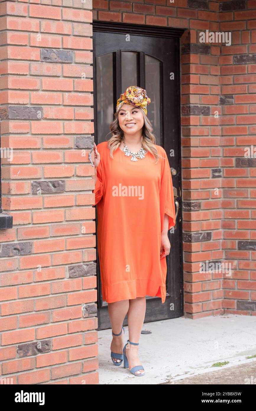 Beautiful asian woman wearing orange hi-res stock photography and ...