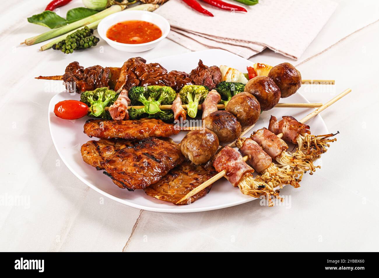 Asian grilled skewer assortment satay with beef, porl, chicken and ...