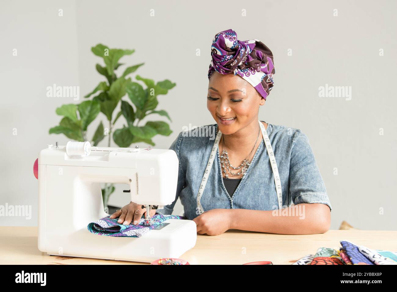 African american woman using a sowing machine Stock Photo - Alamy