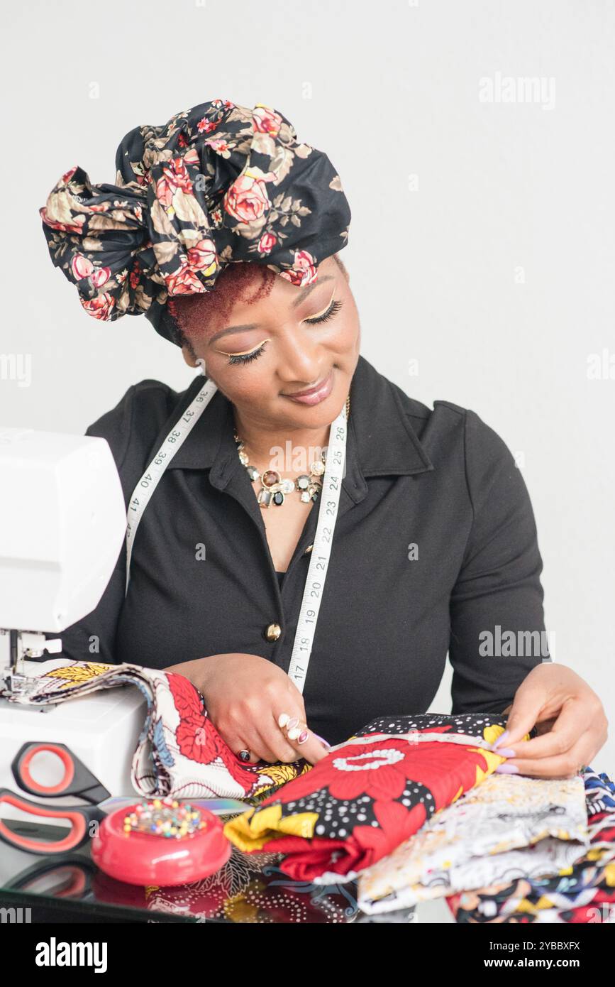 Woman using her ruler to measure her fabric Stock Photo - Alamy