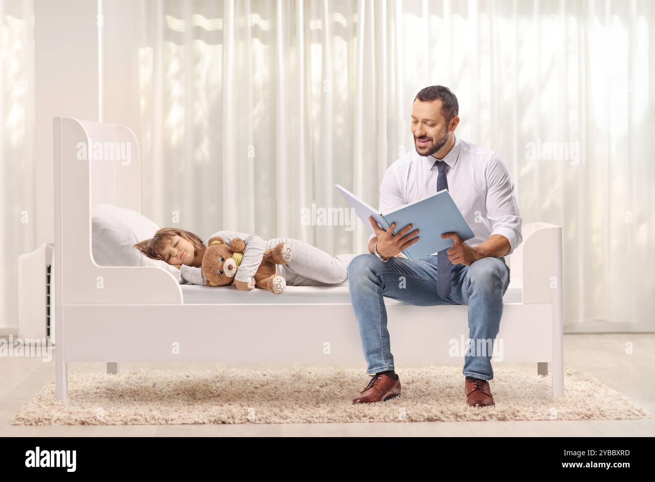 Father reading a book to a sleeping child in bed Stock Photo - Alamy