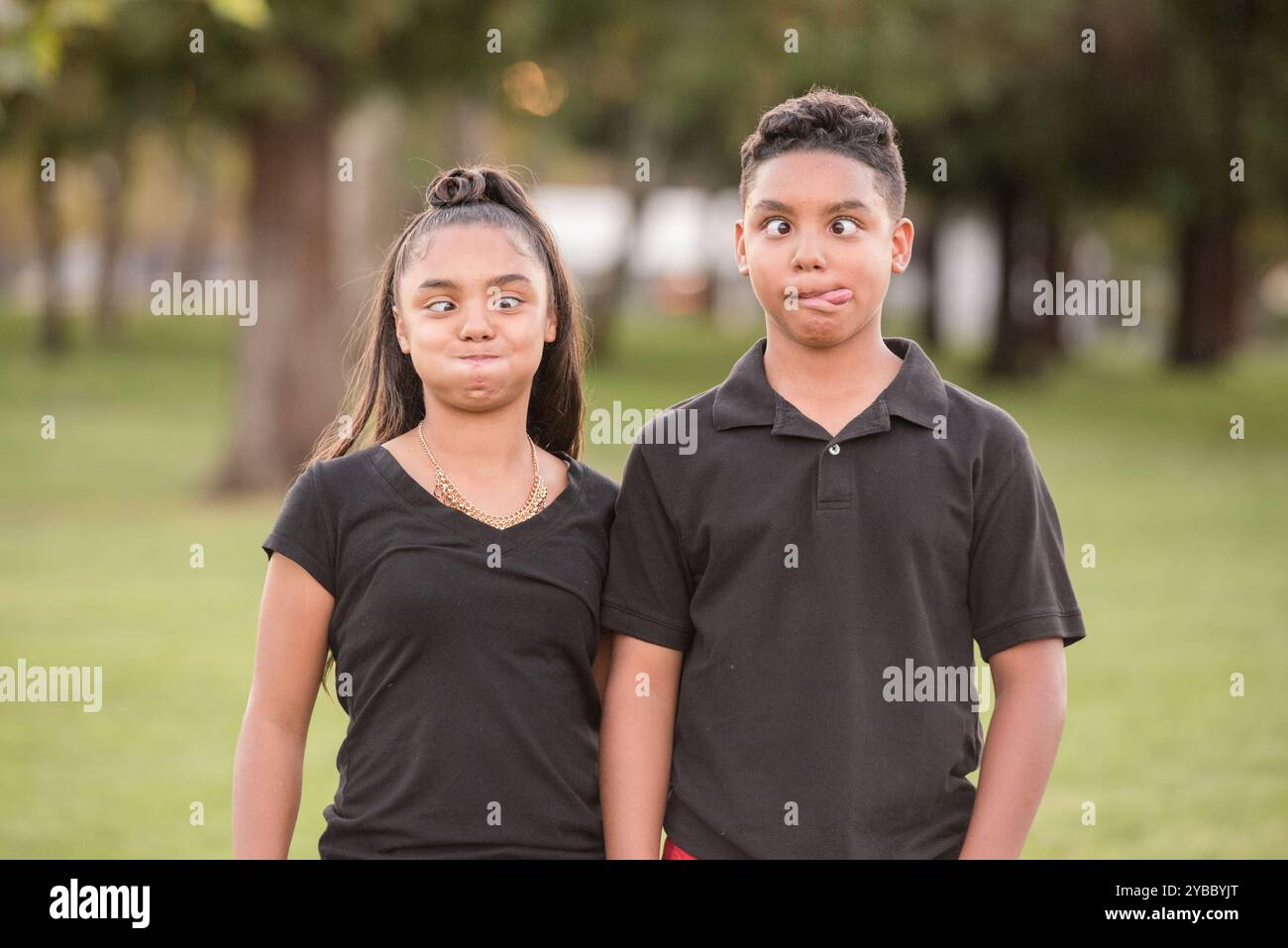 Brother and sister making silly faces Stock Photo - Alamy