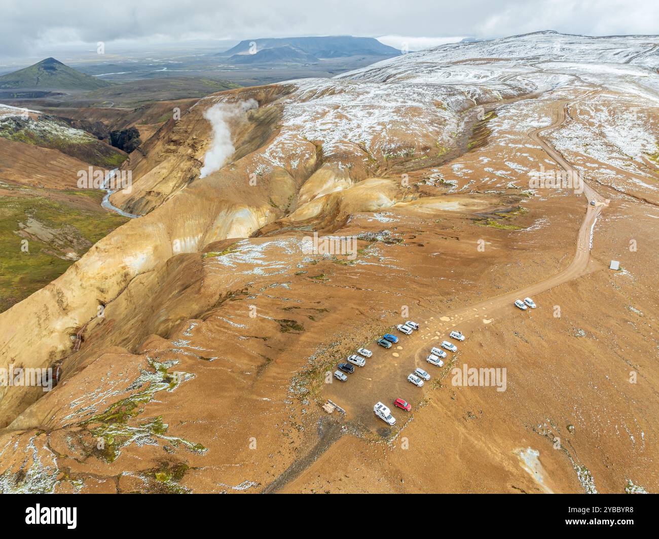 Steaming hot springs and colourful rhyolite mountains, parking lot ...