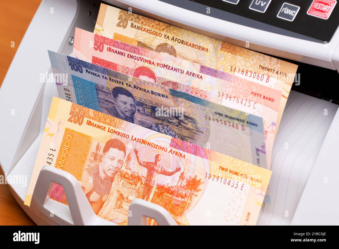 South African money - rand in the counting machine Stock Photo - Alamy