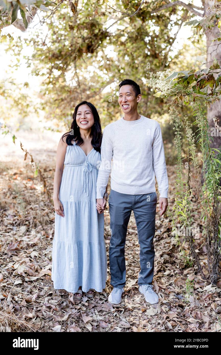 Happy asian couple standing hi-res stock photography and images - Alamy