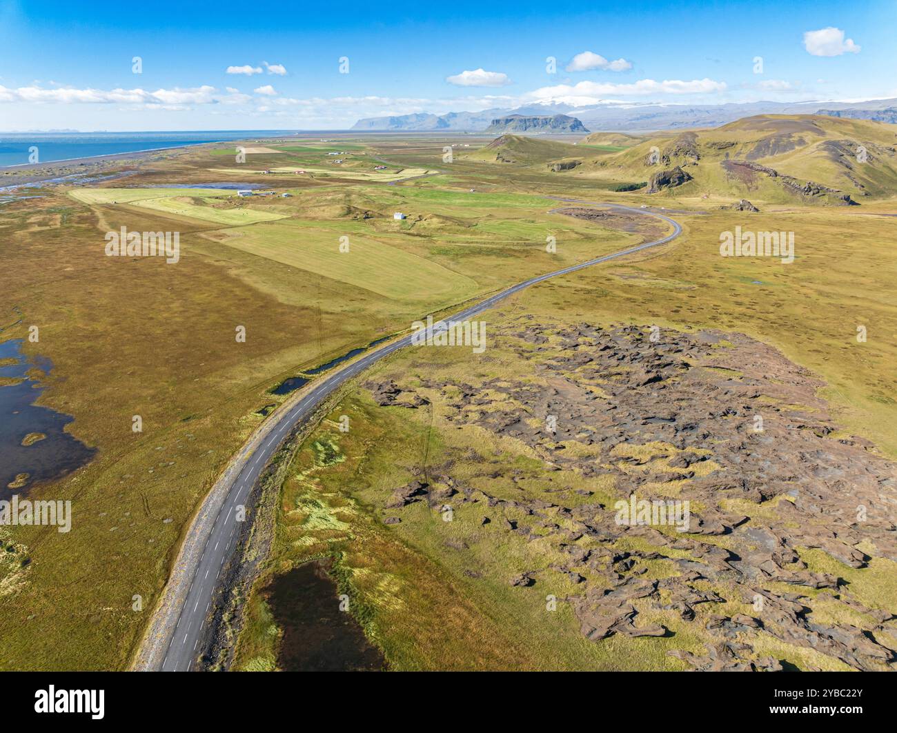 Aerial view of road leading to Cape Dyrholaey, lava formations and ...