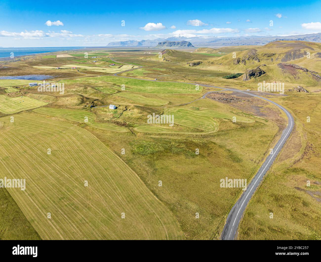 Aerial view of road leading to Cape Dyrholaey, lava formations and ...