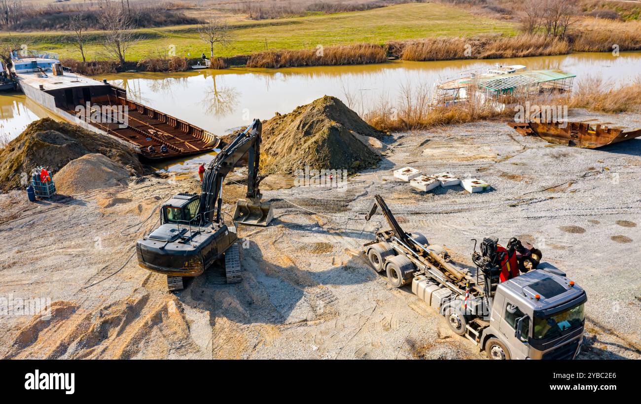 Above view excavator and tow truck together they are pull out part of ...