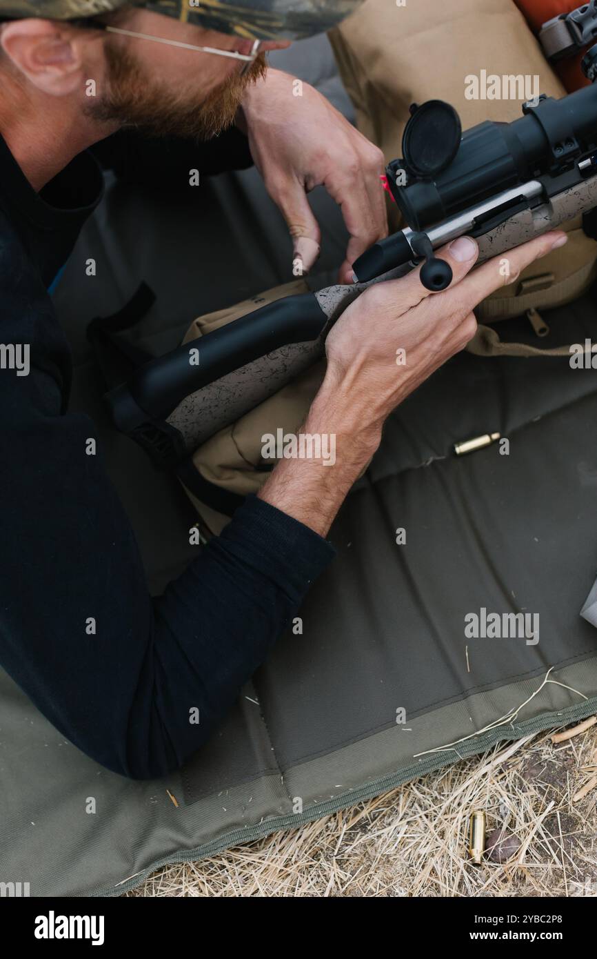 Man adjusting Ruger rifle bolt at Boise shooting range Stock Photo - Alamy