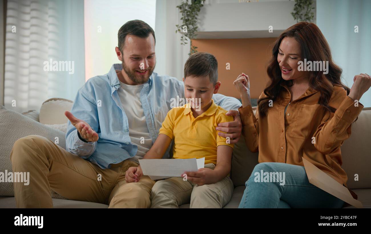 Boy celebrating exam result parents hi-res stock photography and images ...
