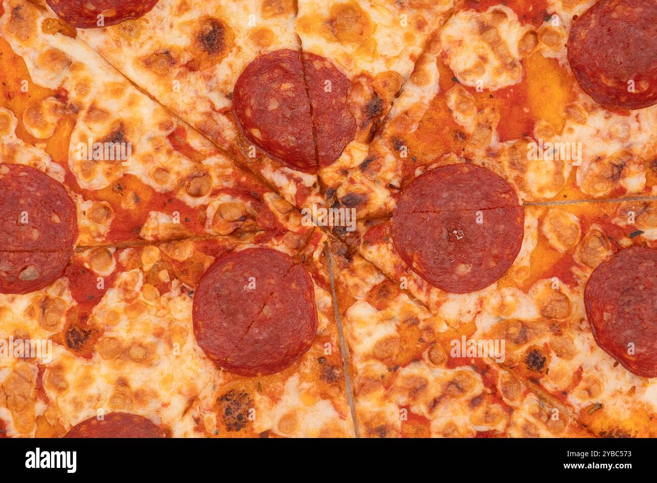 Tasty pizza texture background. Sliced pizza overhead view Stock Photo ...