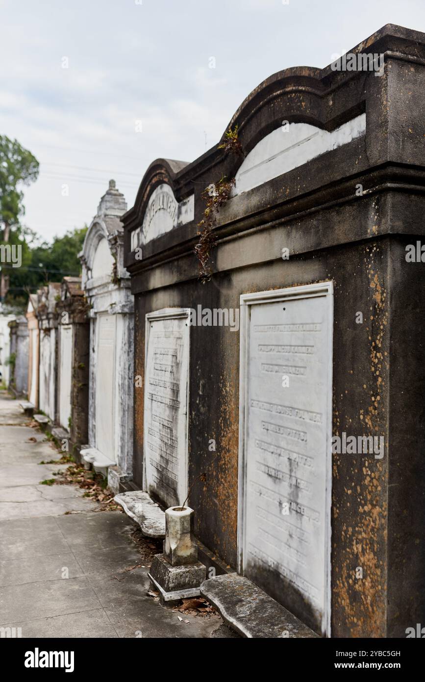 Ancient, history and tombstone outdoor in cemetery for spiritual memory, remembrance and resting ...