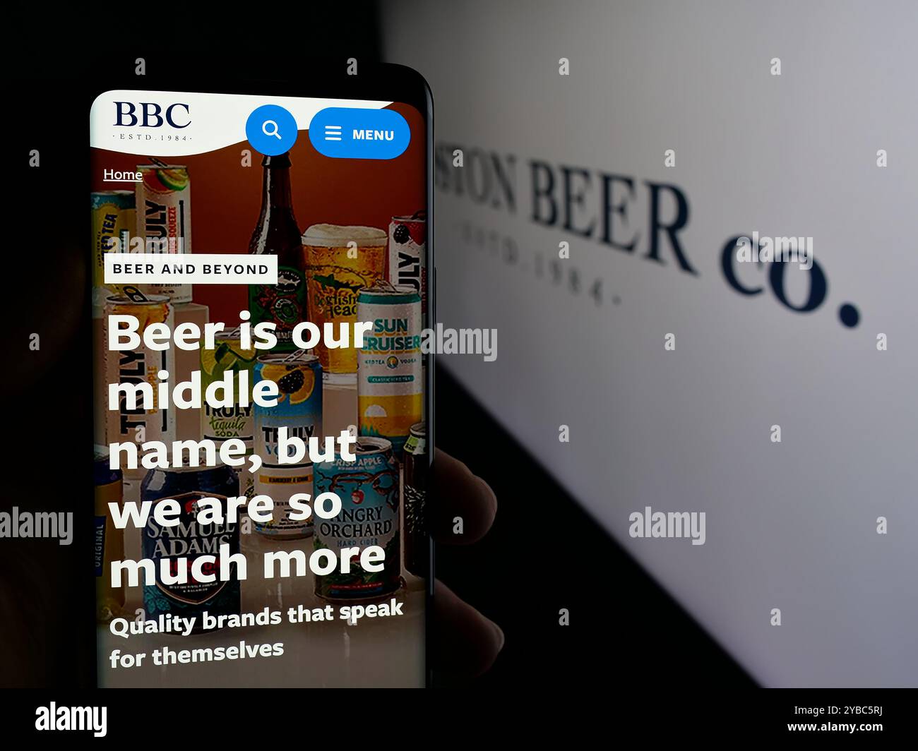 Person holding smartphone with web page of US brewery business Boston ...