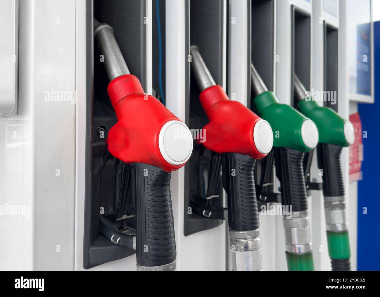 Gasoline and diesel distributor at the gas station. Gas pump nozzles ...