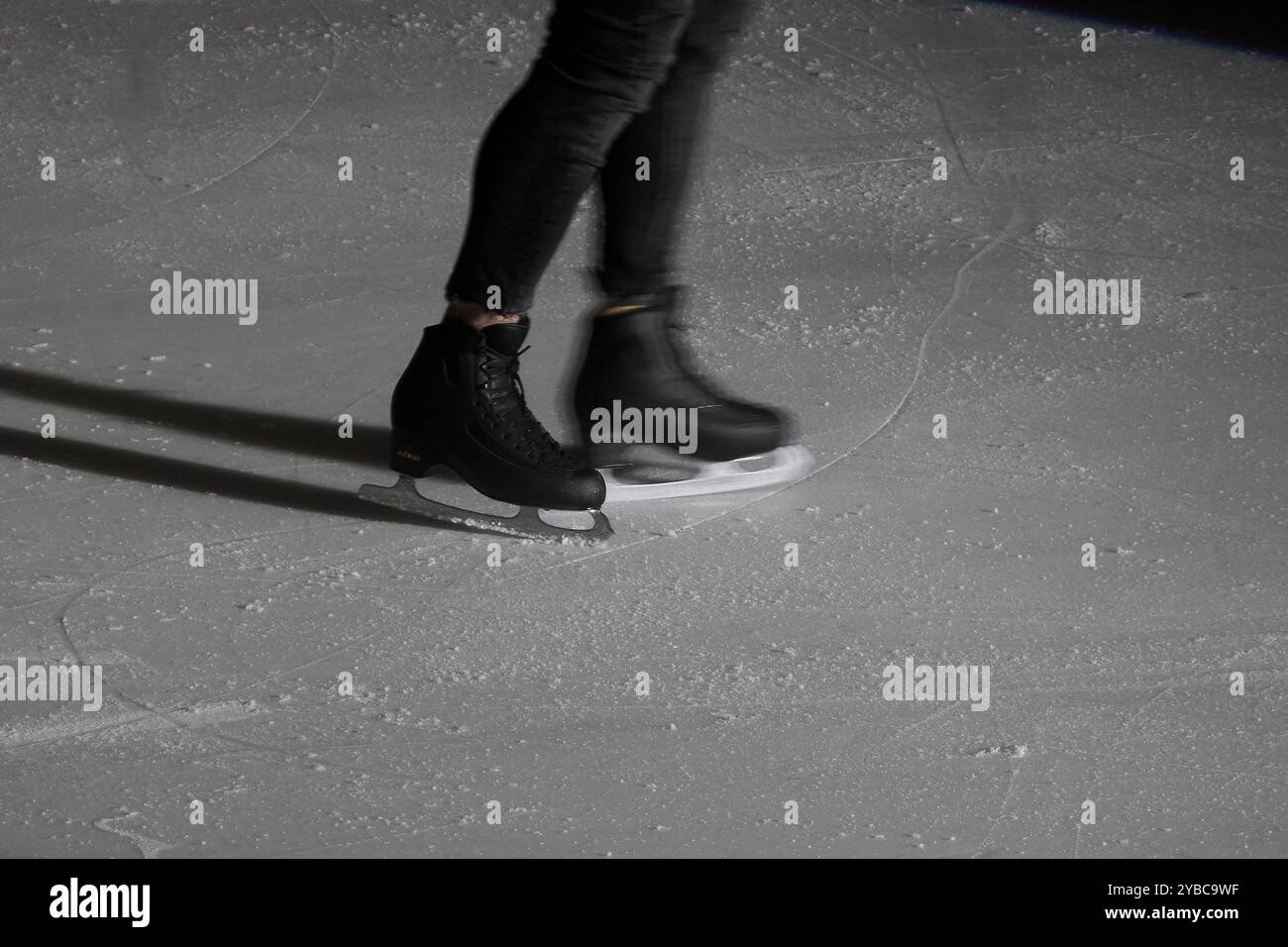 skaters ice skating detail Icy background on rink with visible traces ...