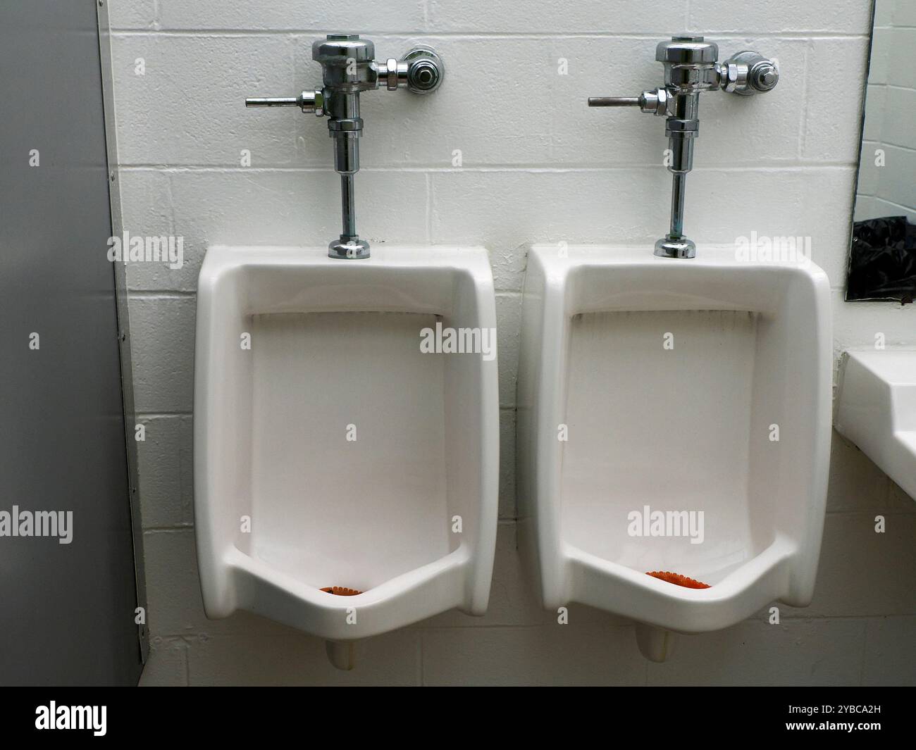 masculine public restroom urinals wc detail view Stock Photo - Alamy
