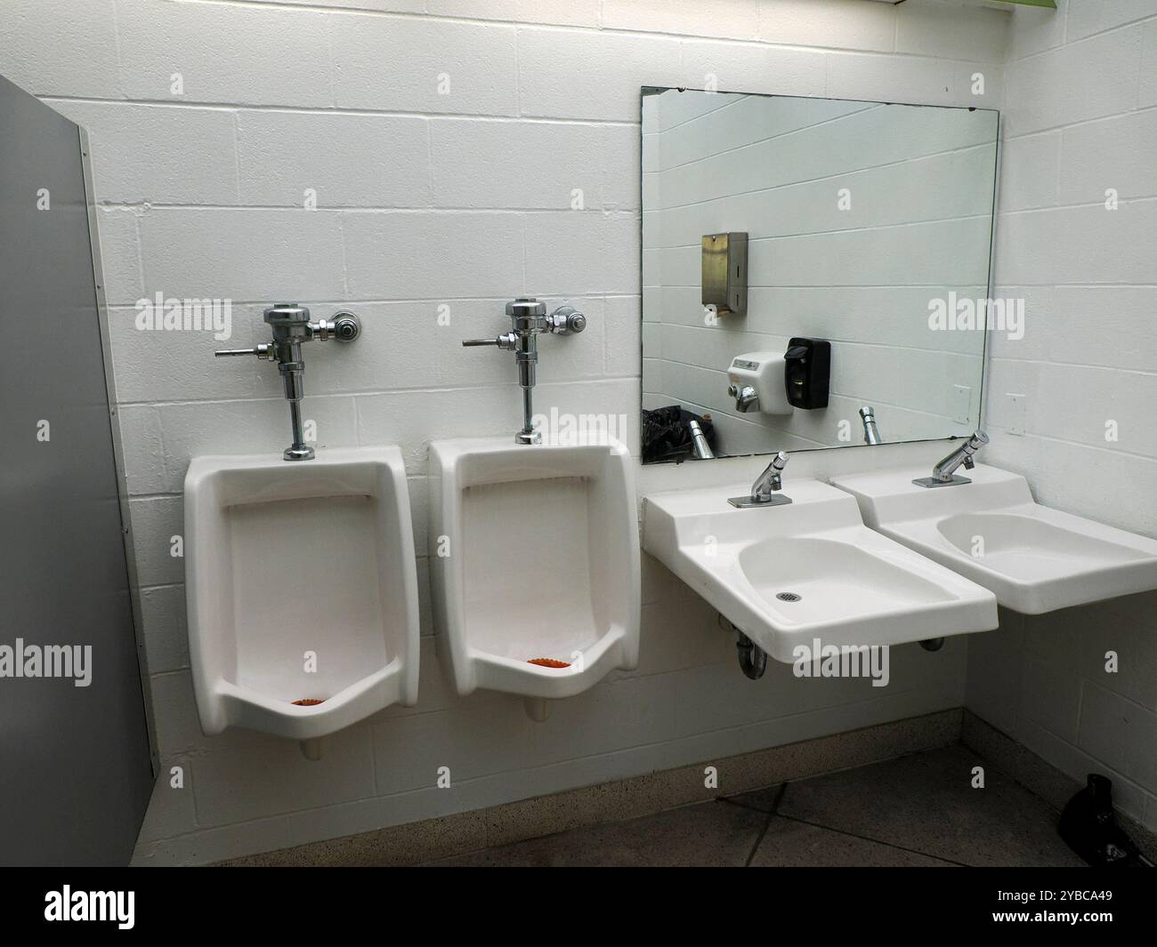 masculine public restroom urinals wc detail view Stock Photo - Alamy