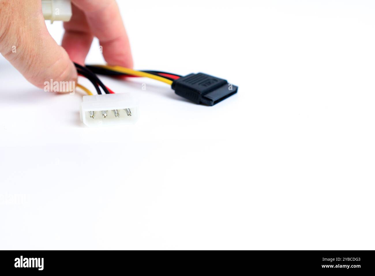 Hand holding IDE to Sata connector adapter on white background Stock ...