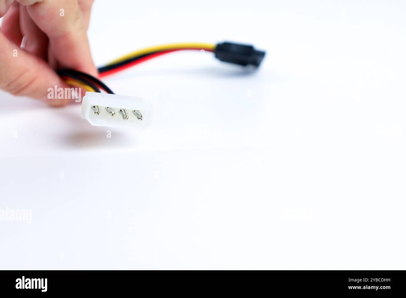 Hand holding IDE to Sata connector adapter on white background Stock ...