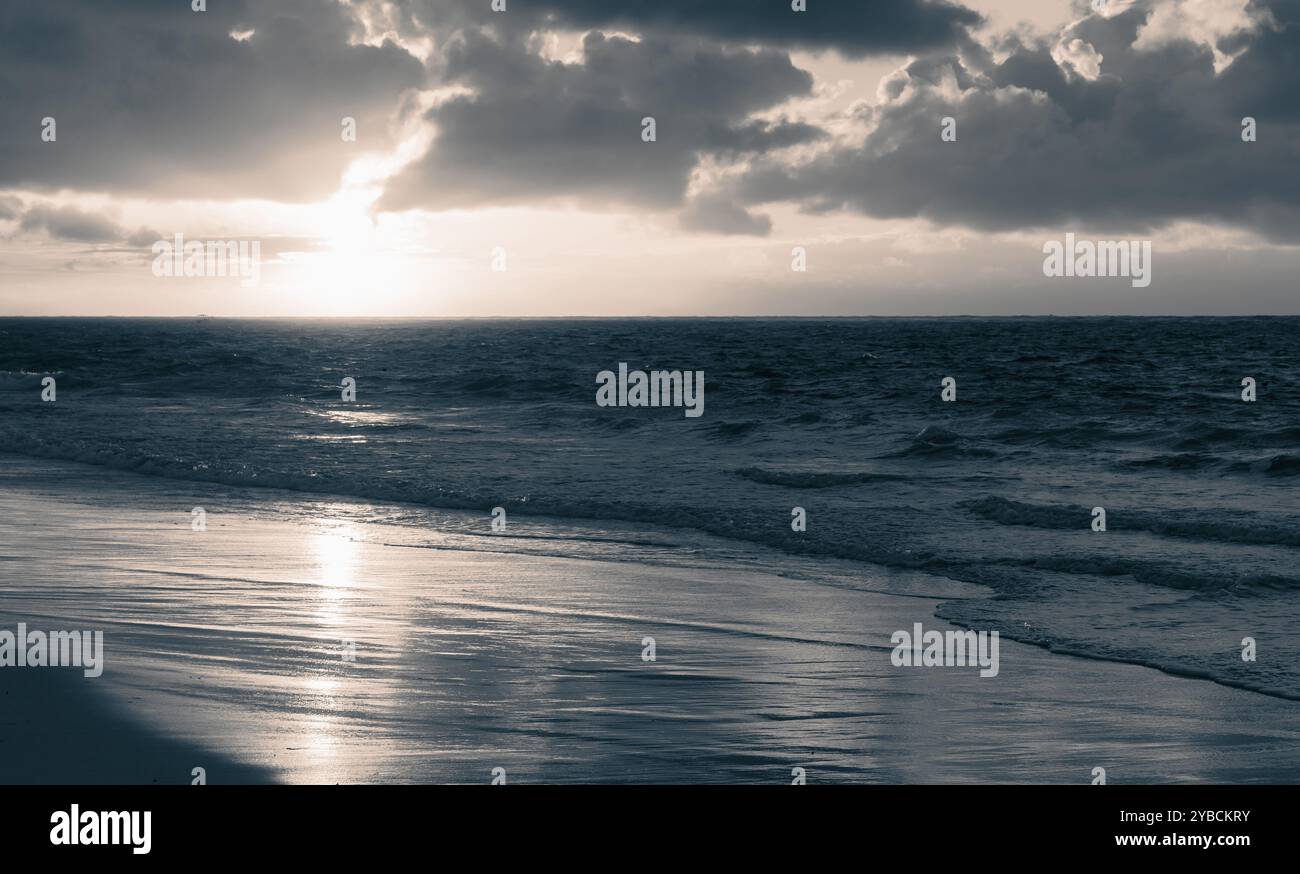 Atlantic ocean coastal landscape with shore waves under cloudy sky at ...