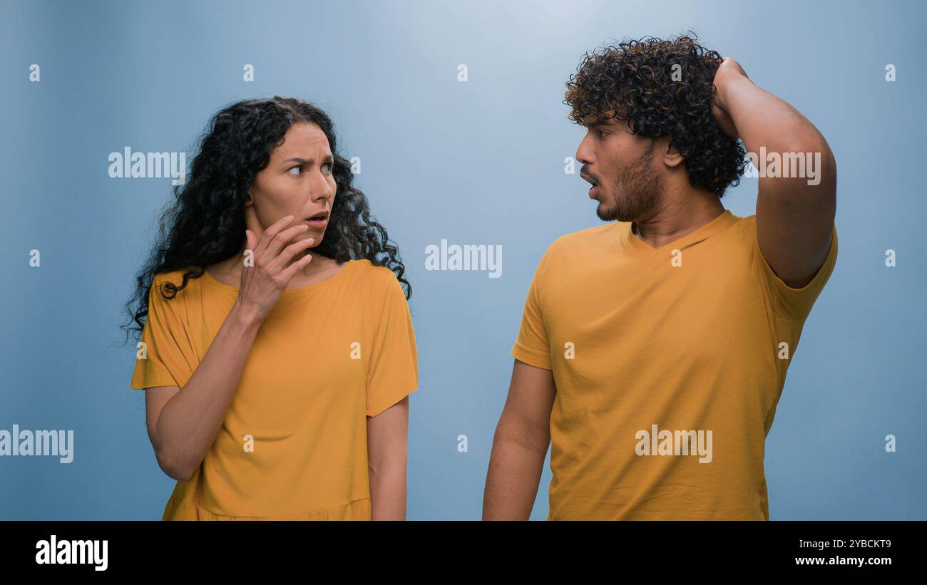 Multiracial shocked scared afraid couple amazed shocked Hispanic woman ...