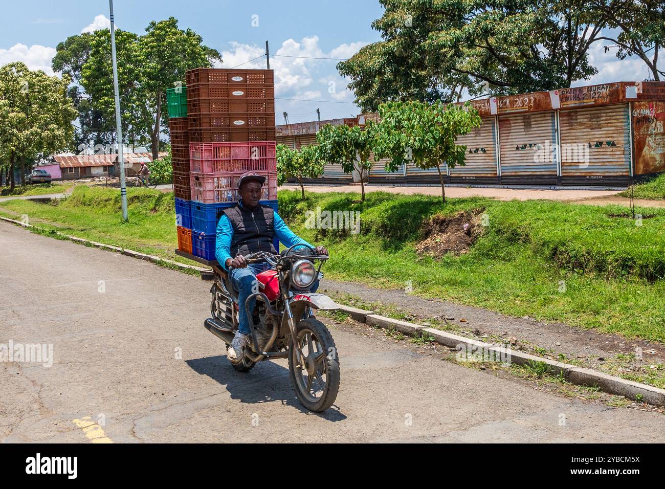 Motorbike carrying a load of 18 plastic crates, Kenya, Africa Stock ...