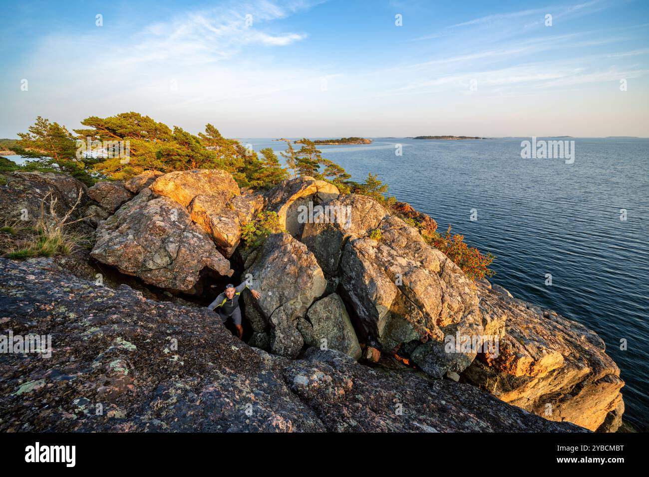 Exploring a cave at Parainen archipelago, Finland Stock Photo - Alamy