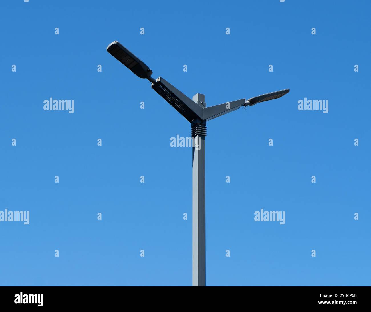 A modern street LED lighting pole. Urban electro-energy technology ...