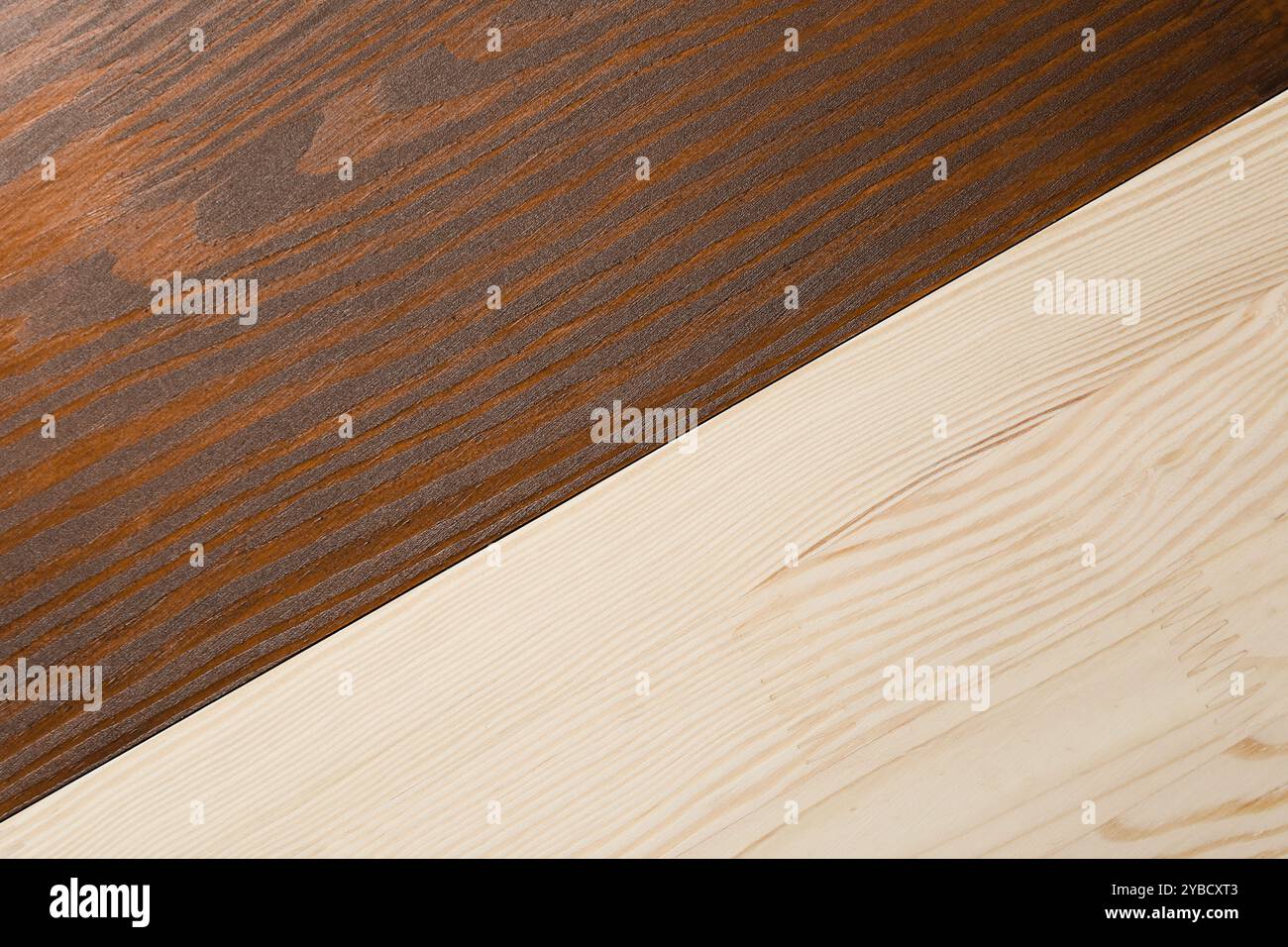 Applying walnut wood stain. Texture of wooden surface as background ...