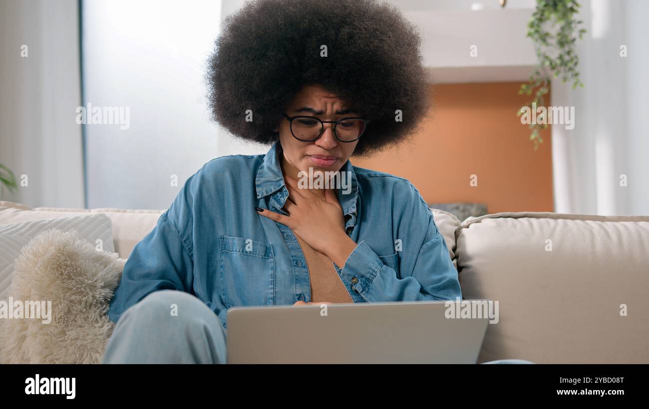Worried African American woman stressed with laptop frustrated ...