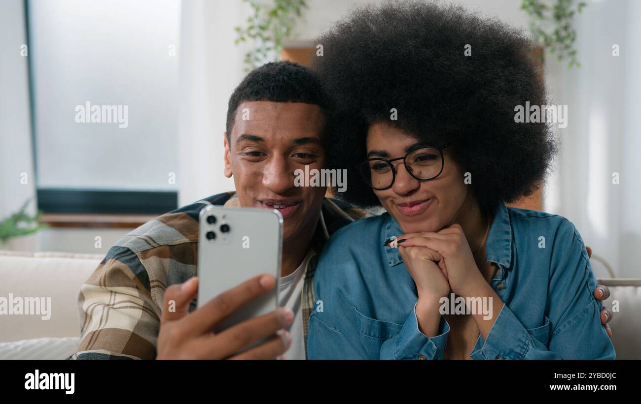 African American happy couple family laughing talking pleasant ...