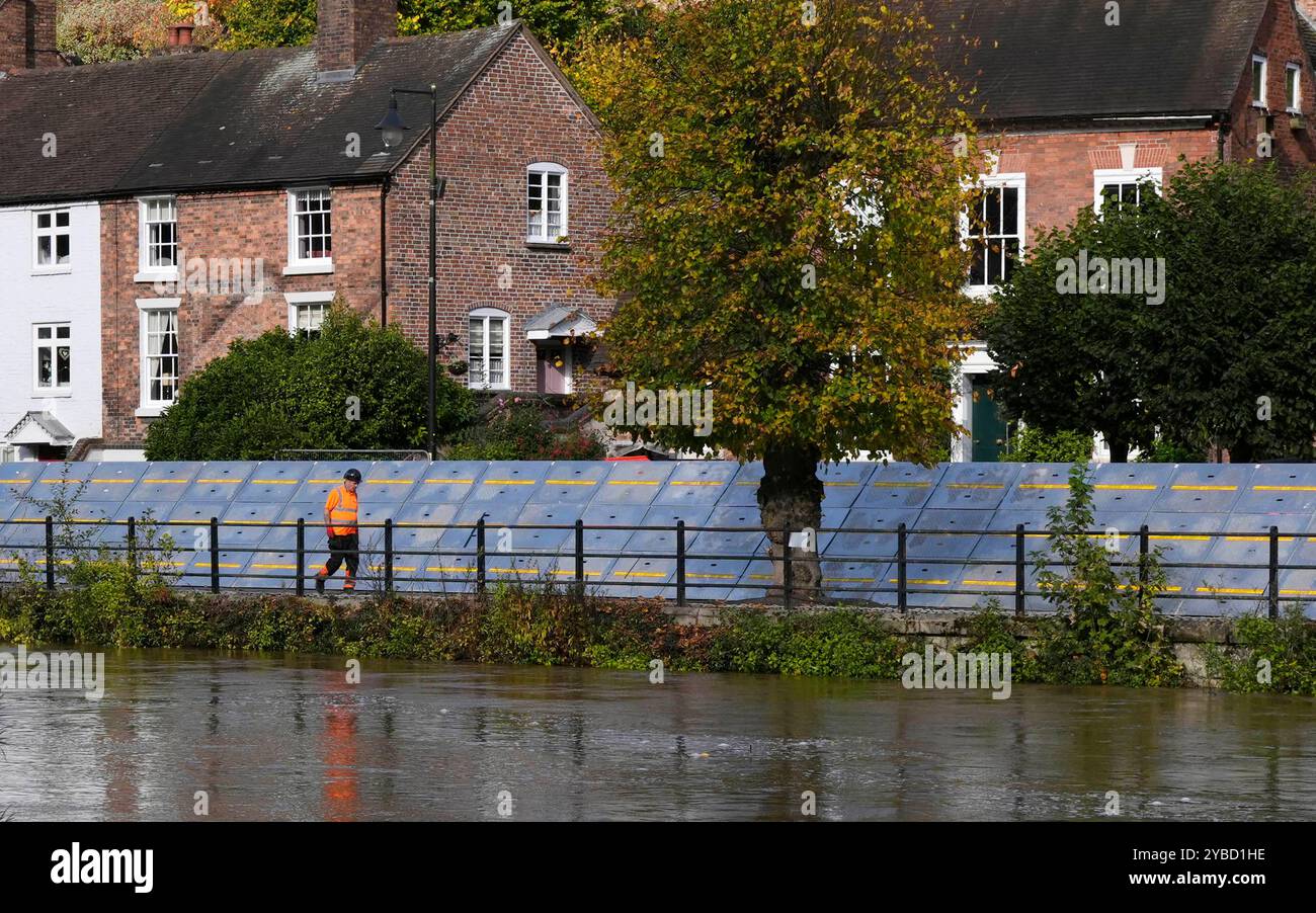 Flood defences are put in place along the wharfage next to the River ...