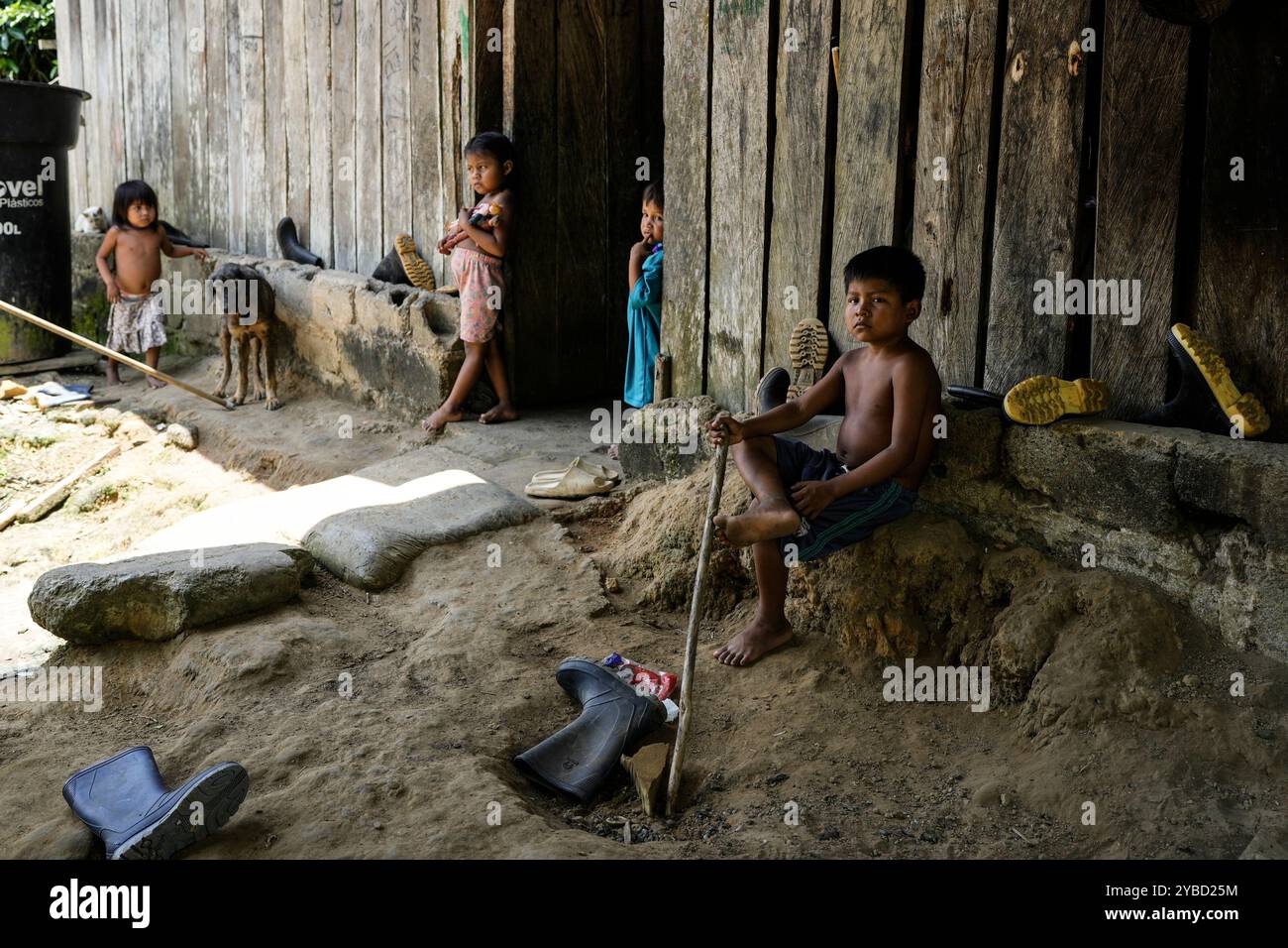 Indigenous children of the Embera community play outside of their home ...