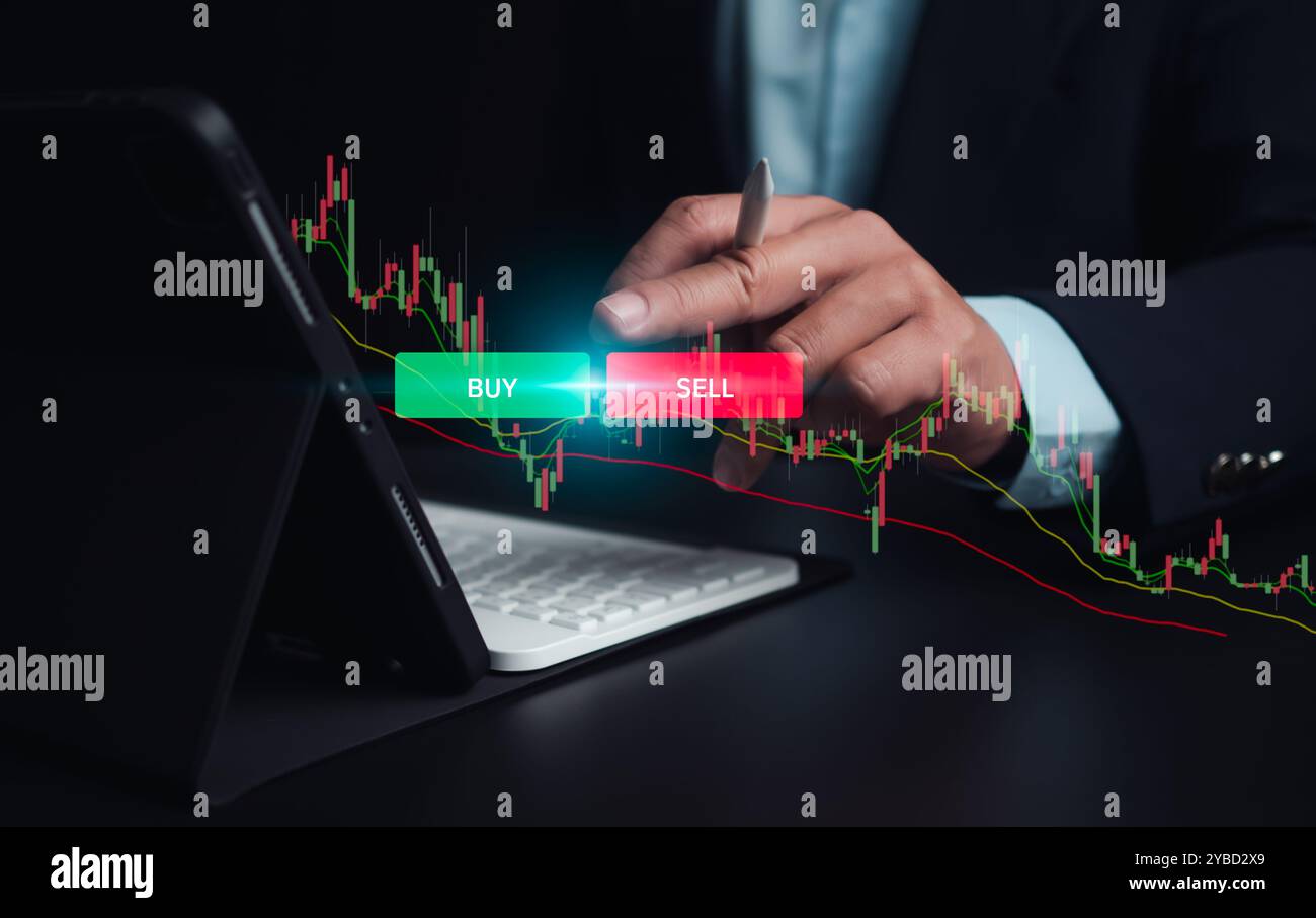 Investors use laptops to analyze stock market, investment strategies ...