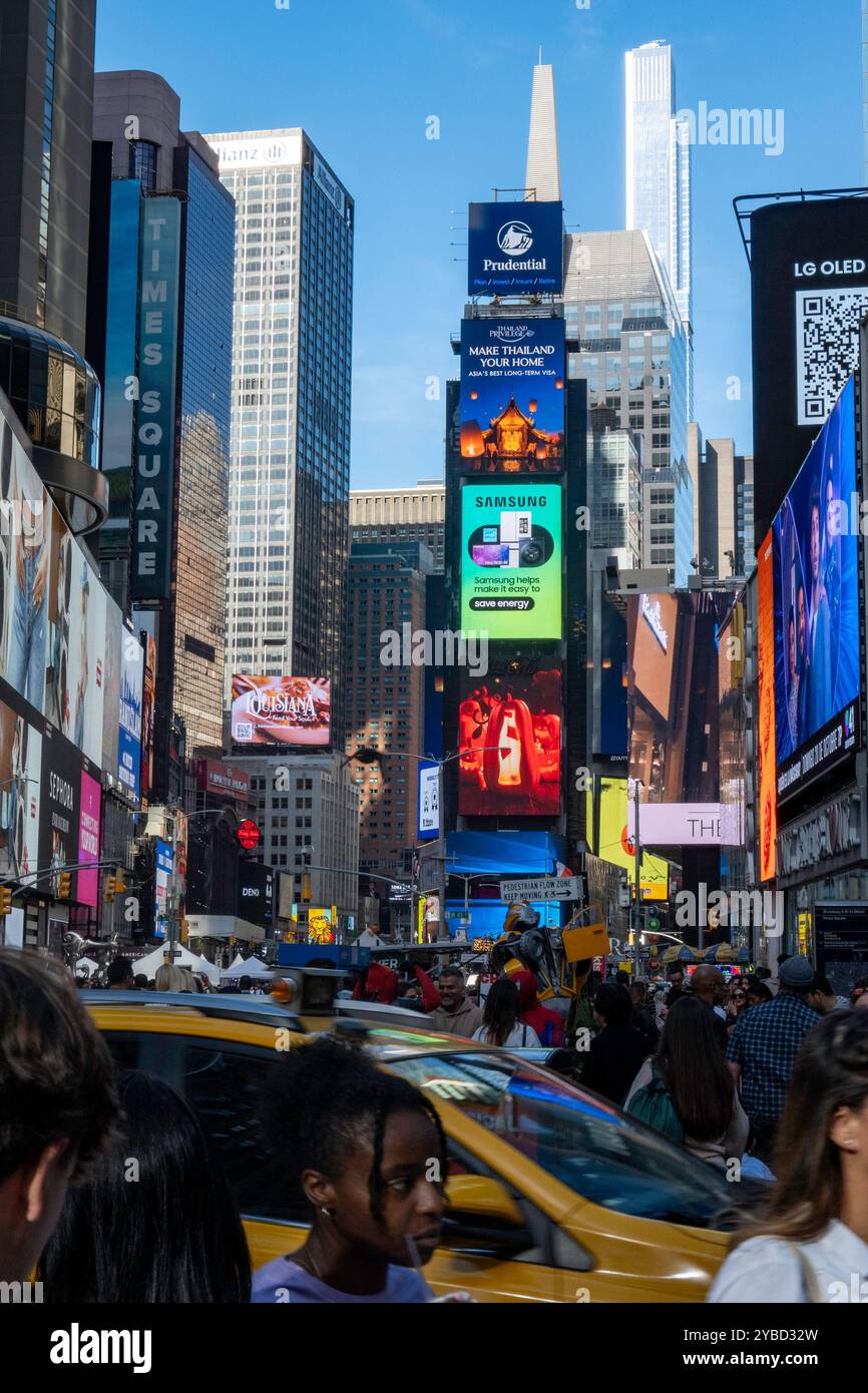 Times Square is filled with electronic billboards advertising a little ...