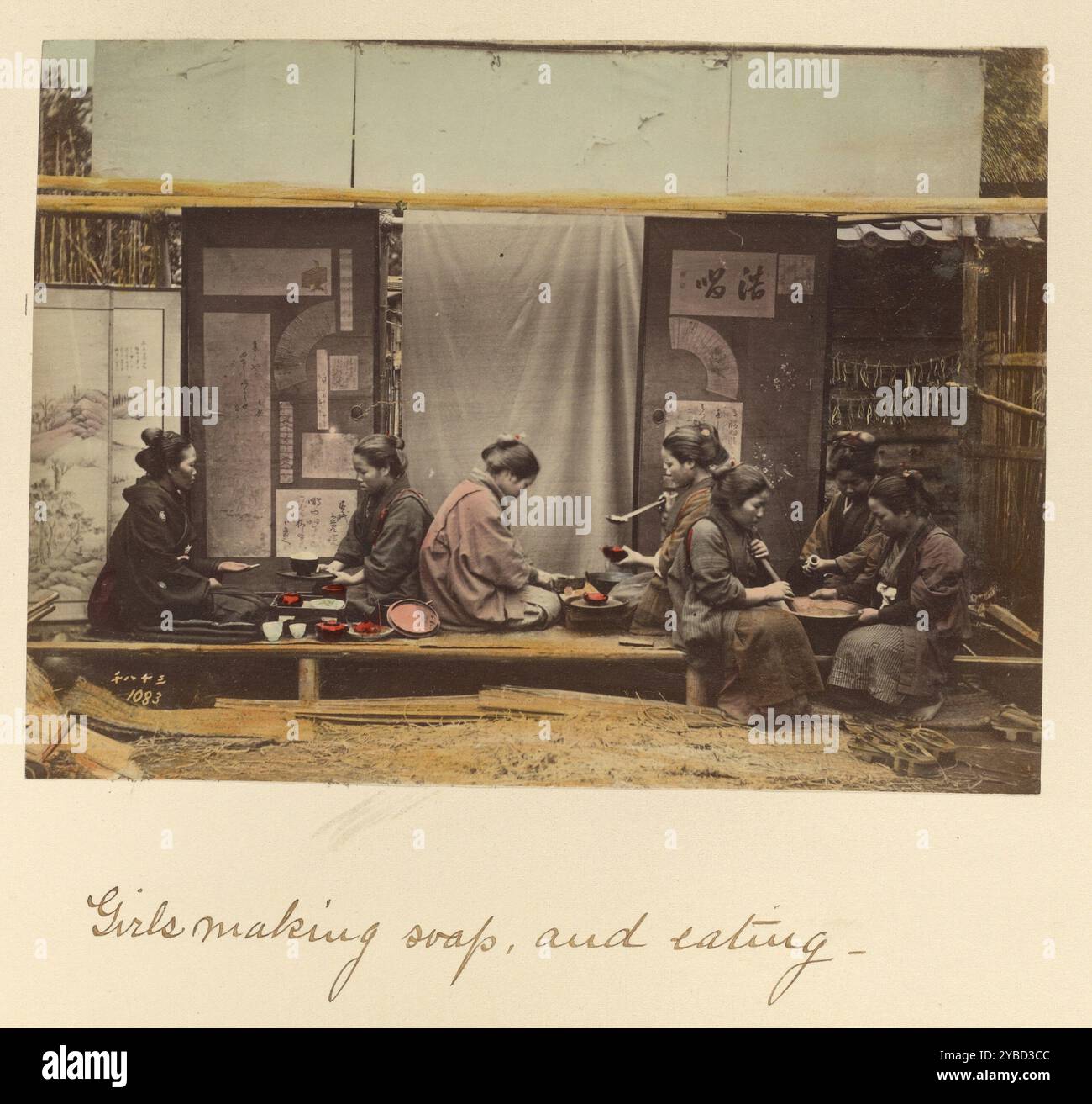 Girls making soap, and eating, about 1873-1883. Four girls sitting on a ...