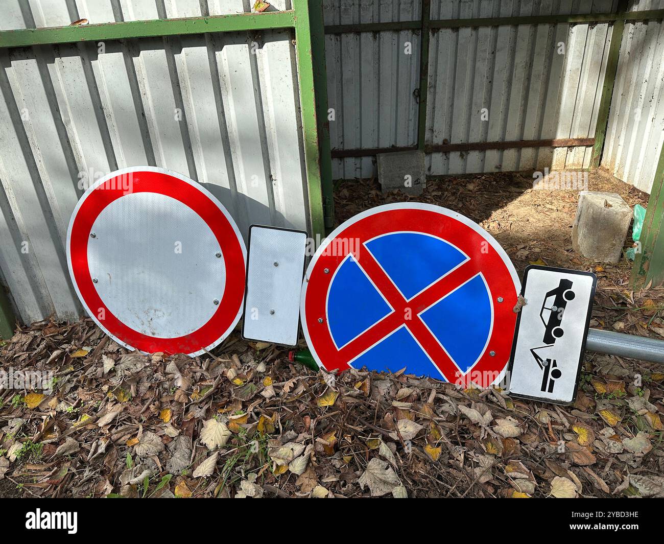 Broken traffic sign pole on the ground Stock Photo - Alamy