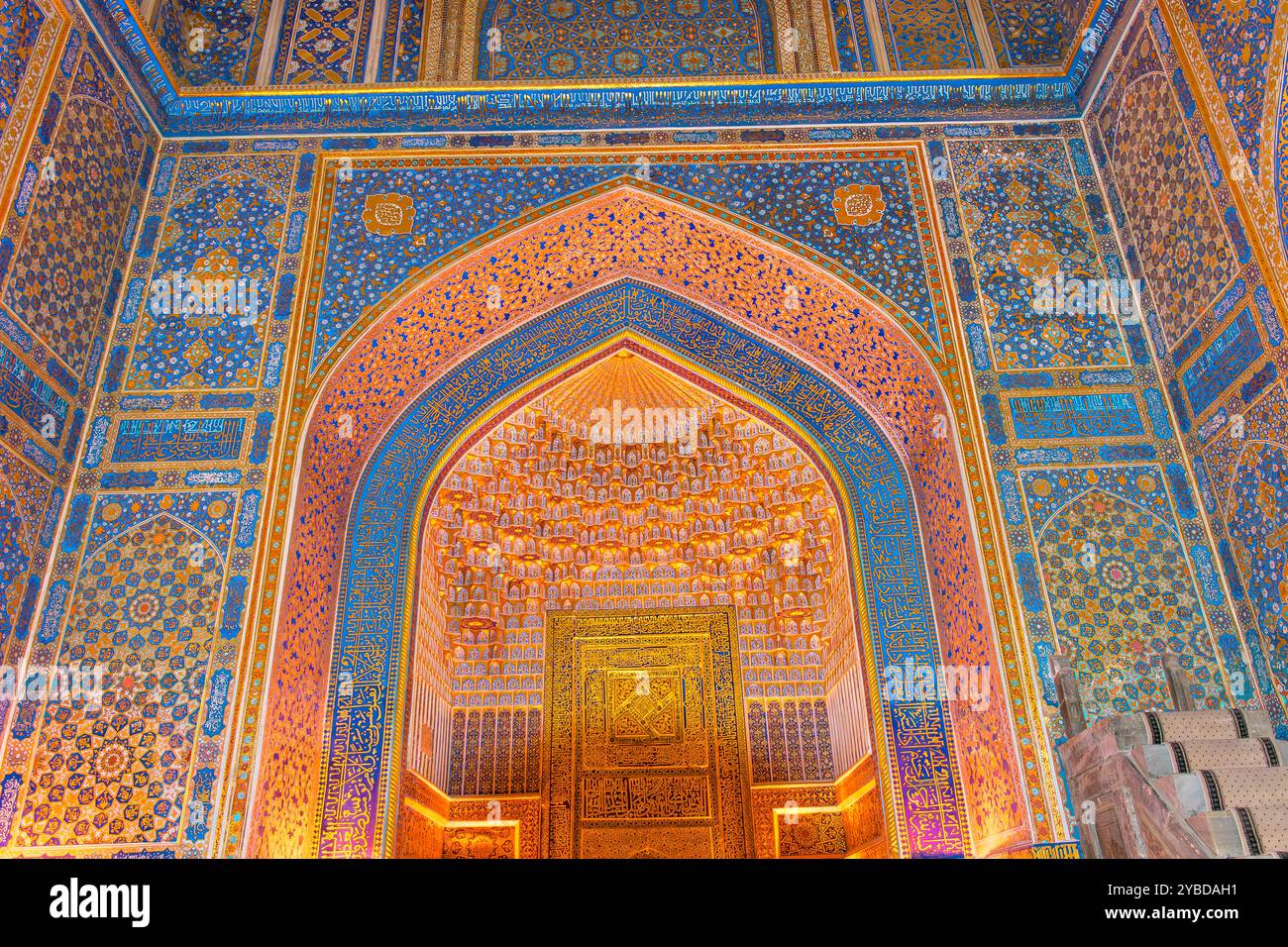 The illuminated interior of one of the grand madrasahs in Registan ...