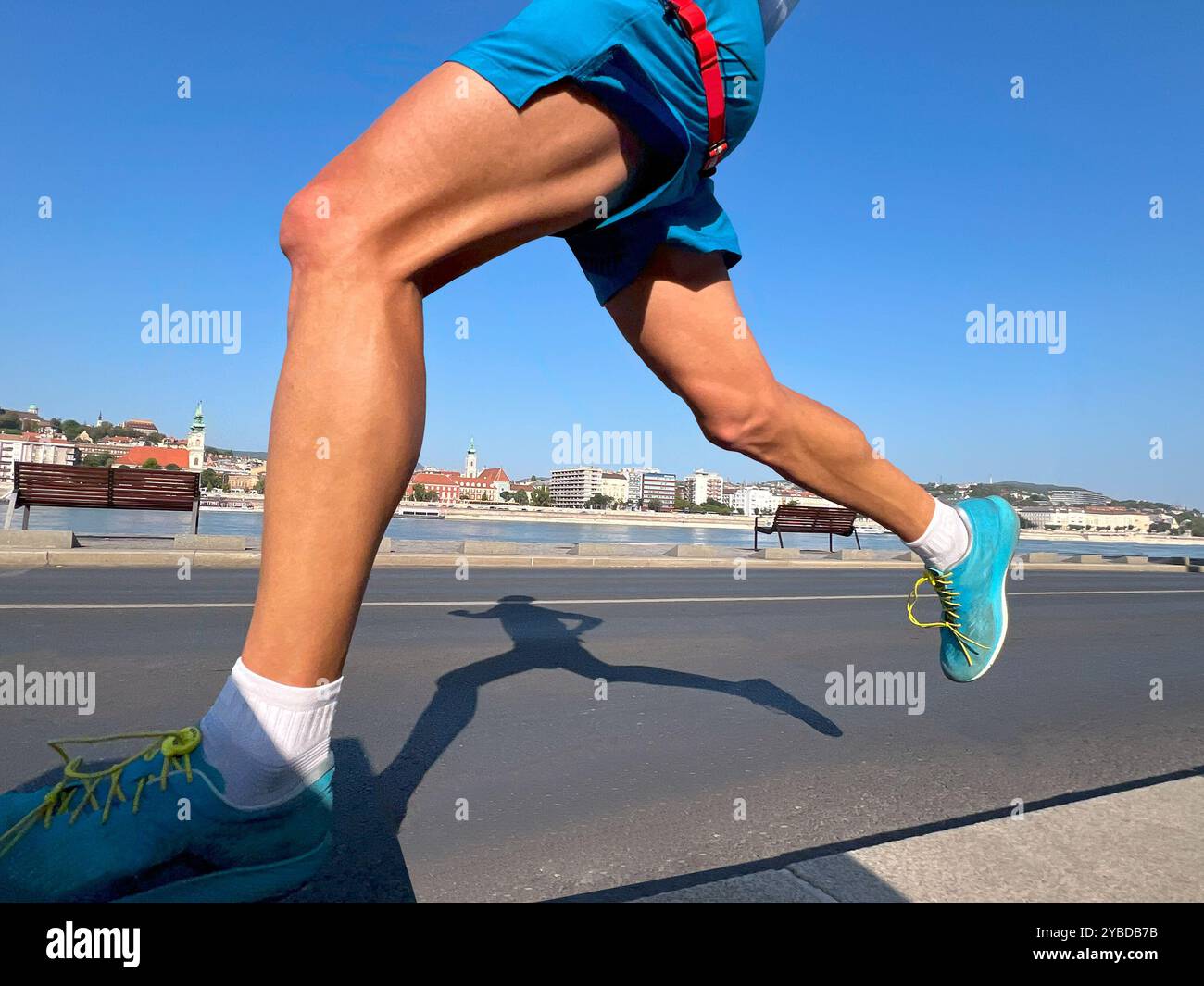 legs athlete runner, shadow on asphalt of running man Stock Photo - Alamy