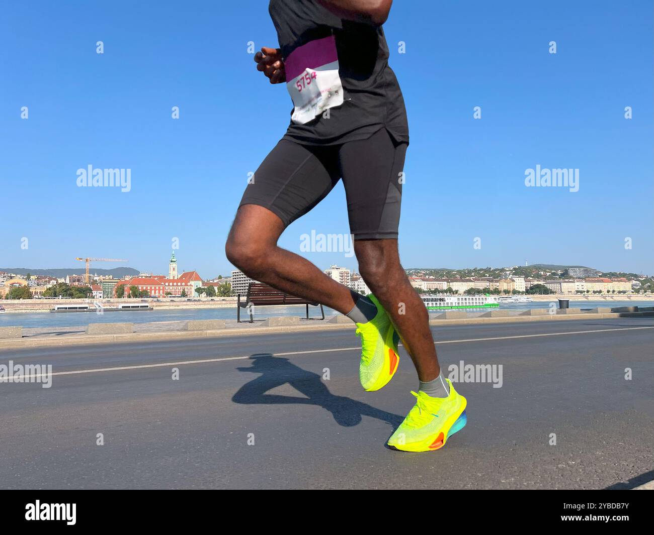 legs black athlete running marathon in embankment river Stock Photo - Alamy