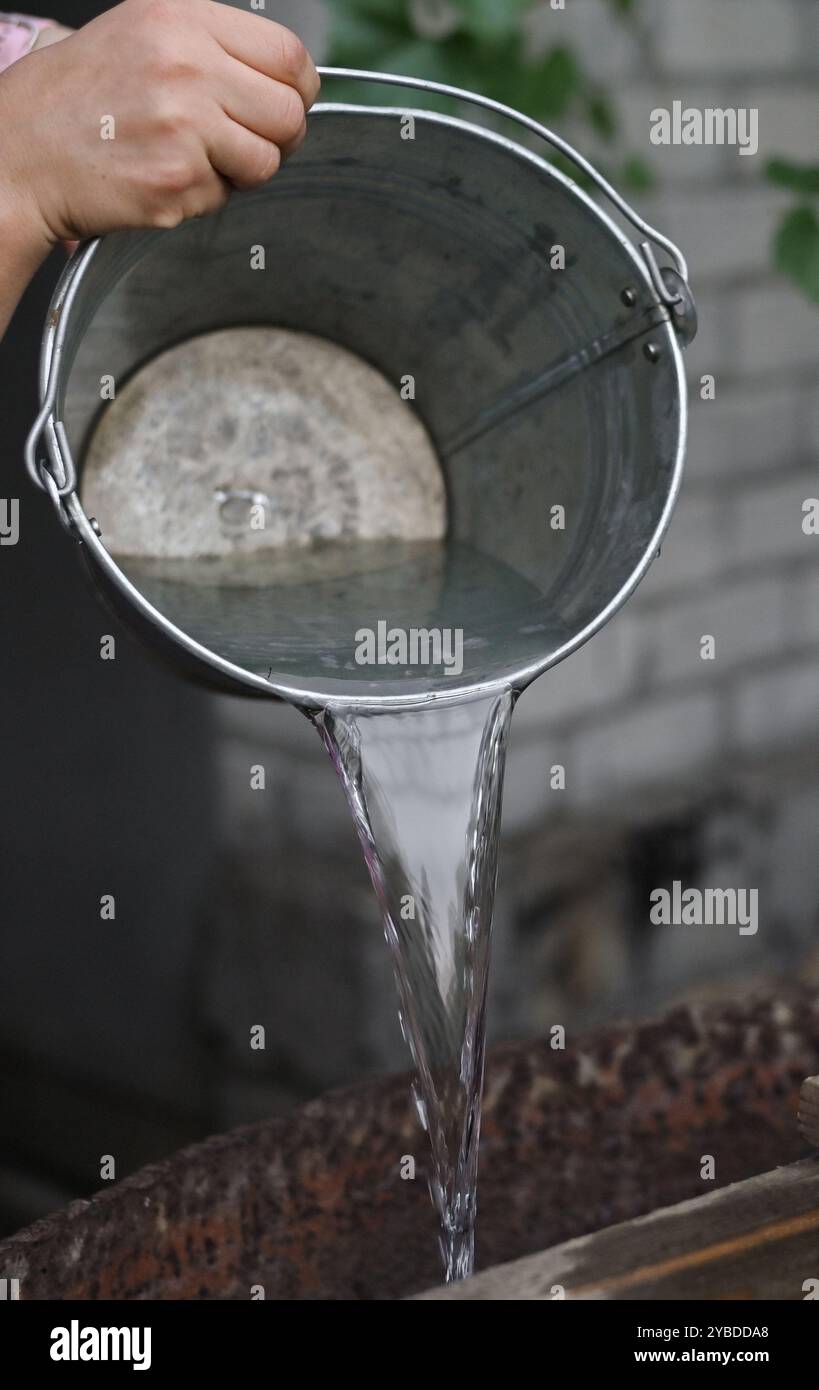 Bucket water pour fun hi-res stock photography and images - Alamy