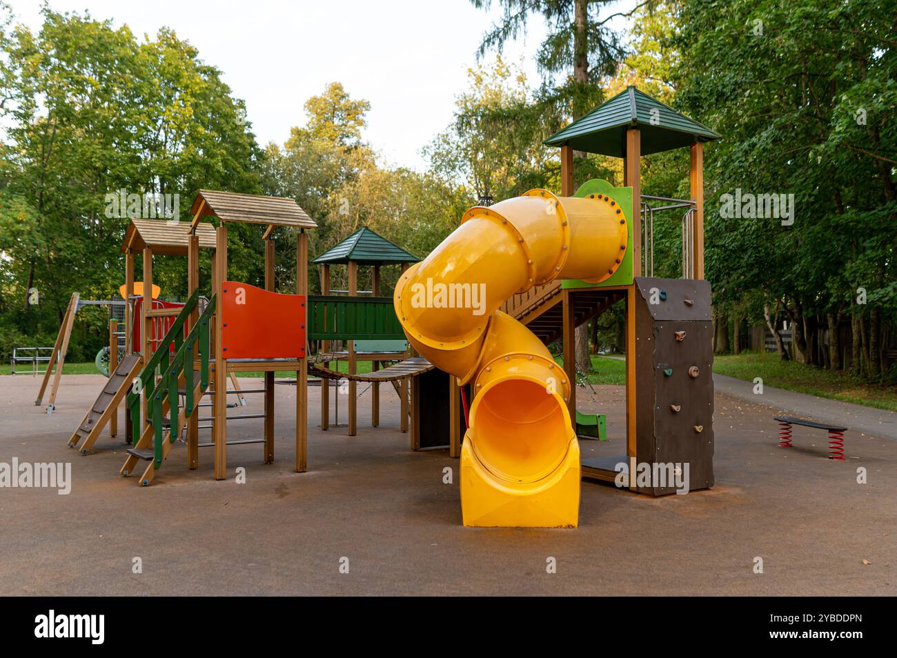 Bright playground climbing structures slides hi-res stock photography ...