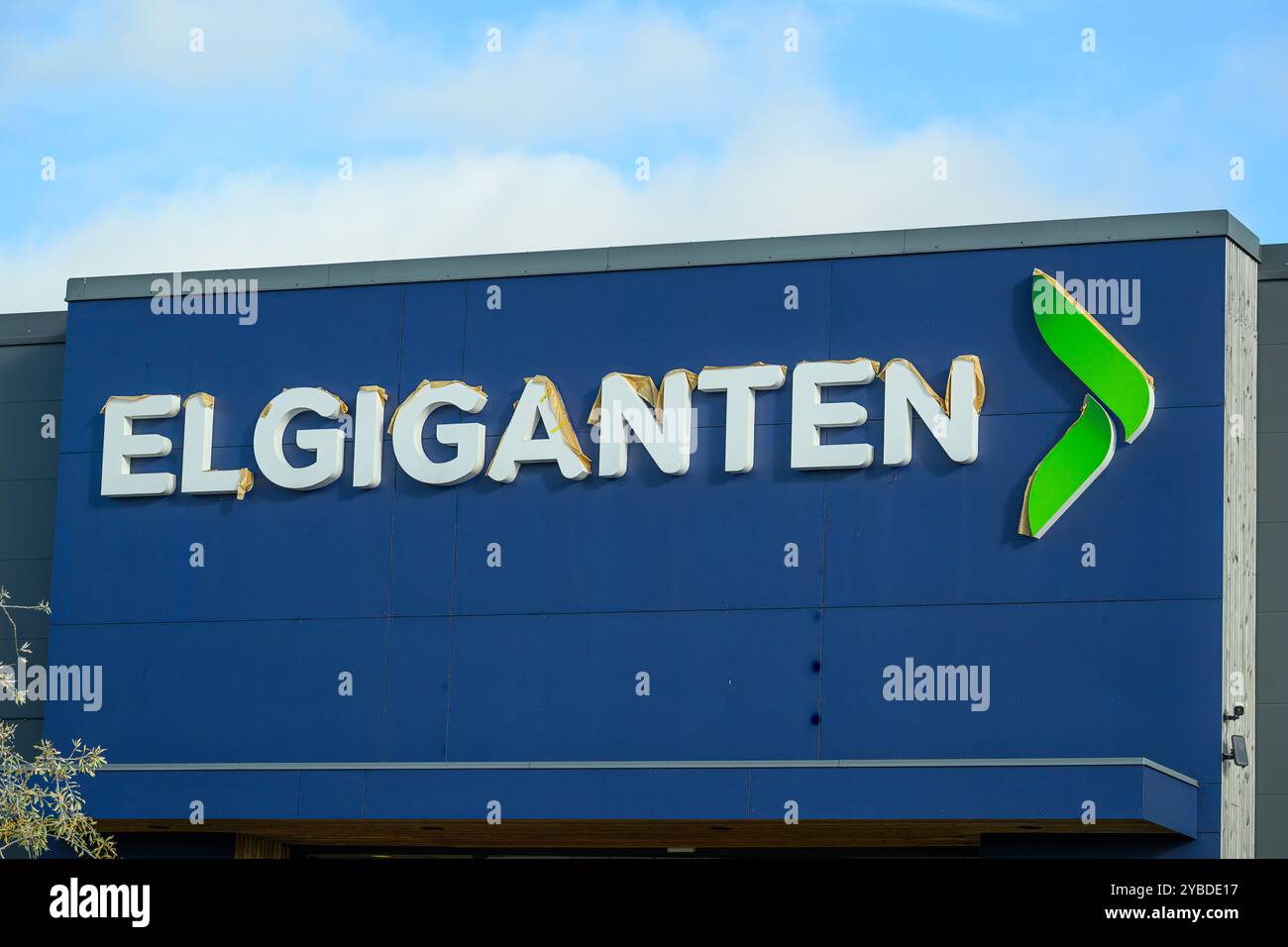 The facade of a retail store displays the Elgiganten sign prominently ...